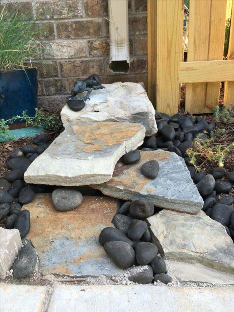 29 Rock-Based Downspout Ideas to Transform Outdoors