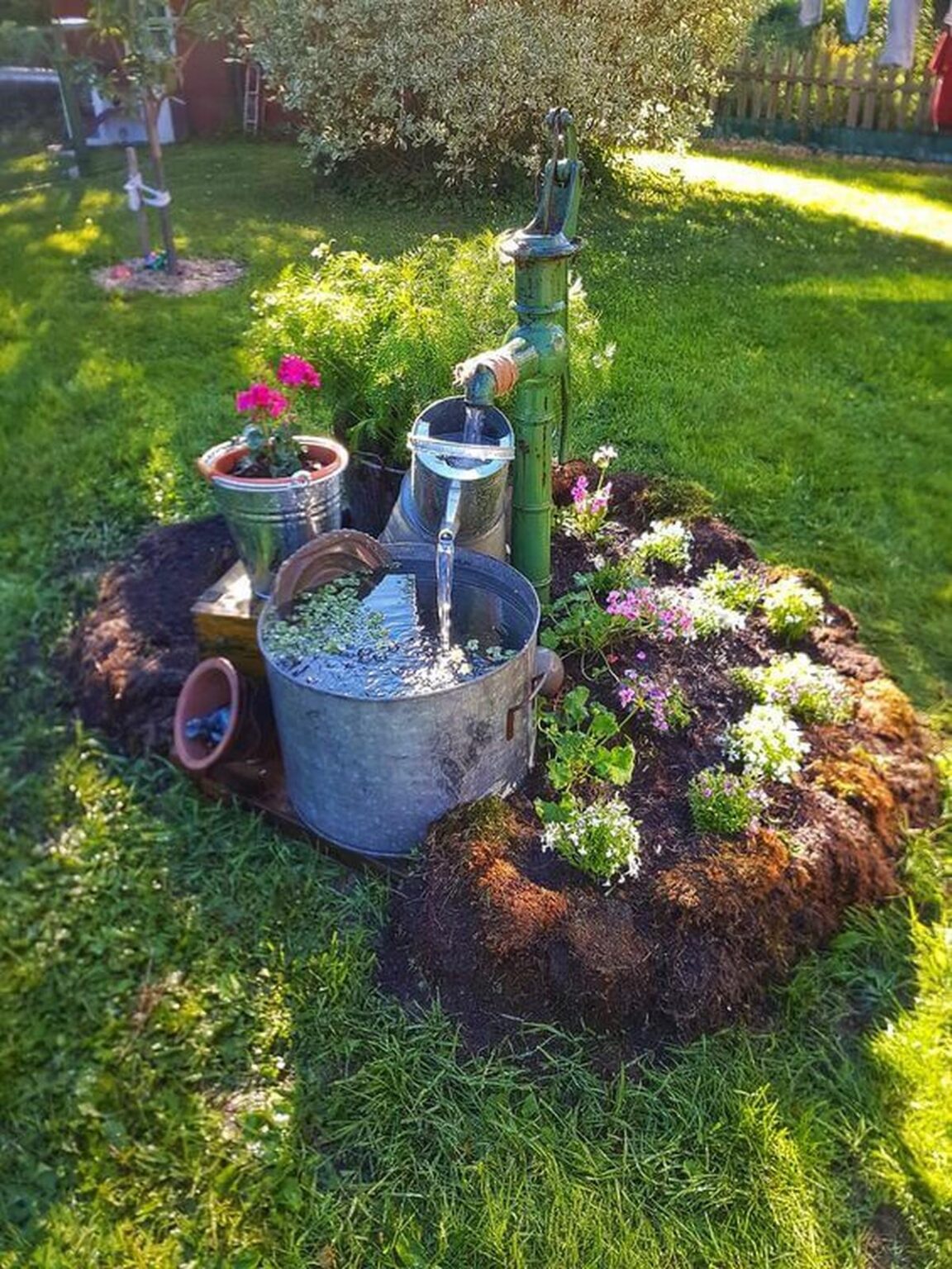 23 Unique Uses for Old Hand Pumps in Gardens