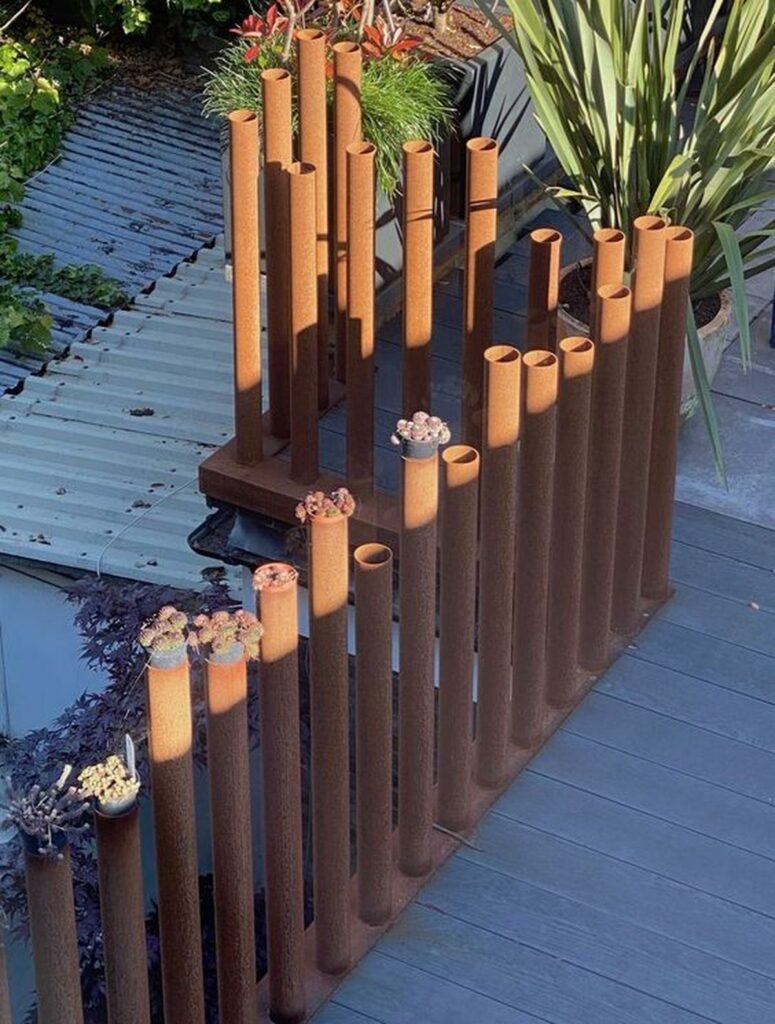 37 Elegant Pipe and Tower Planters for Compact Spaces